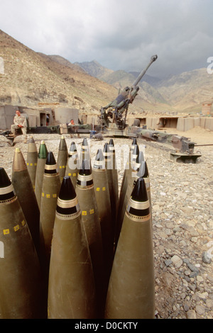 A 155mm high-explosive artillery shell is blasted out of a M198 Stock ...