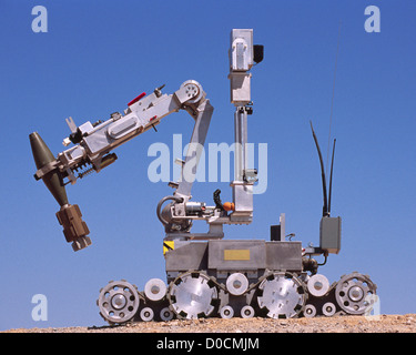 An Explosive Ordnance Disposal Robot Grips a Depleted Uranium Sabot ...