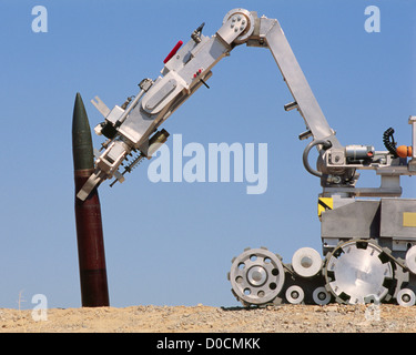 An Explosive Ordnance Disposal Robot Grips a Depleted Uranium Sabot ...
