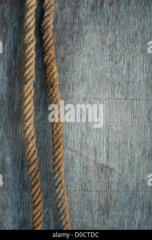ship rope at wooden background texture Stock Photo - Alamy