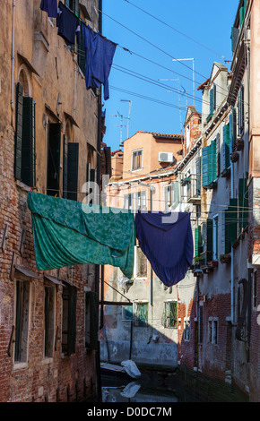 Small canal in Venice with clothesline and laundry Stock Photo - Alamy