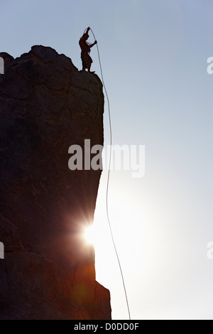 Climber Prepares to Rappel Down an Overhanging Face Stock Photo - Alamy