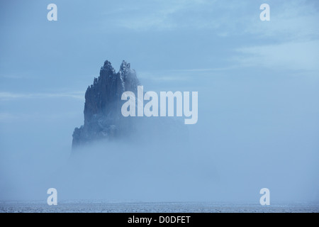 Winter fog shrouds Shiprock, also called Ship Rock, an ancient volcanic ...