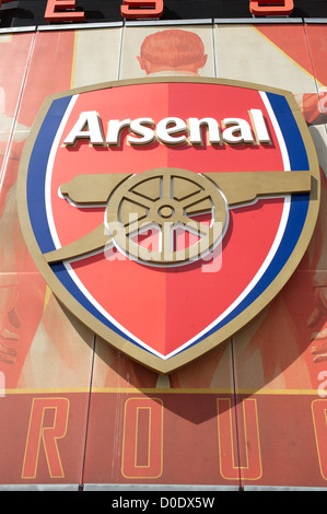 Arsenal football club crest in close up embroidered on a red shirt ...