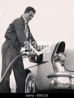 vintage gasoline station gas pump in the setting of an old gas station ...