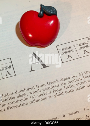 The Letter A In the Dictionary with Apple, Still Life Stock Photo - Alamy