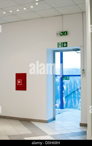 Red fire hydrant and open box with rolled up fire hose inside, Sopron ...