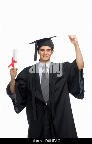 Portrait of happy graduate student holding empty banner. Isolated on ...