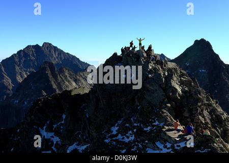 Hikers at the summit of peak Rysy, High Tatras, Slovakia Stock Photo ...