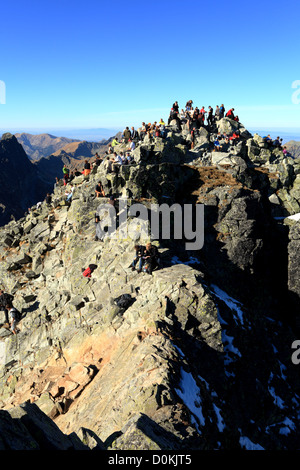 Hikers at the summit of peak Rysy, High Tatras, Slovakia Stock Photo ...