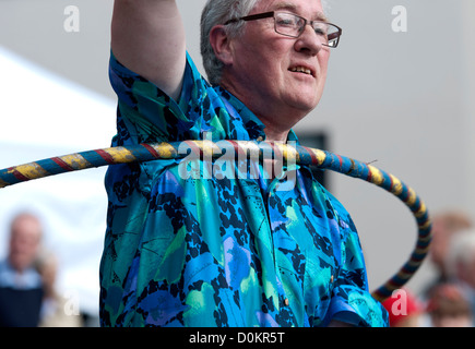 Man doing hula hoop show Stock Photo - Alamy