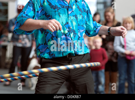 Man doing hula hoop show Stock Photo - Alamy