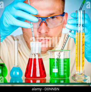 Young chemist in the laboratory. Scientist Using Microscope In Lab ...