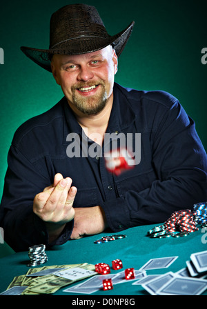man throws dice on a green background Stock Photo - Alamy