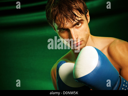 Man sweating all over in boxing gloves Stock Photo - Alamy