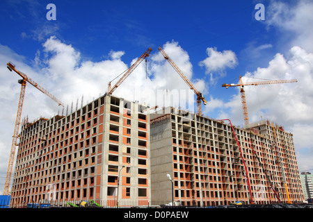 Tower cranes and construction equipment working on a new development on ...