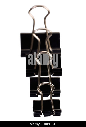 Metallic paper clips in a row isolated over white Stock Photo - Alamy