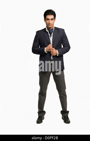 Image of a handsome young man posing isolated over grey wall background ...