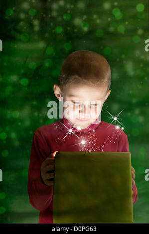 Happy childhood, Christmas magic fairy tale. Little girl waiting for ...