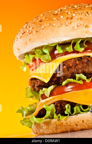 Tasty and appetizing hamburger on a yellow background Stock Photo - Alamy