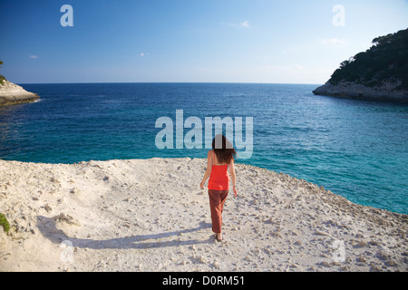 woman on red at Menorca island in Spain Stock Photo - Alamy
