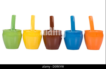 Assorted ceramic containers and soup spoons Stock Photo - Alamy