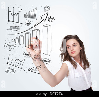 Young business woman drawing diagrams on whiteboard Stock Photo - Alamy