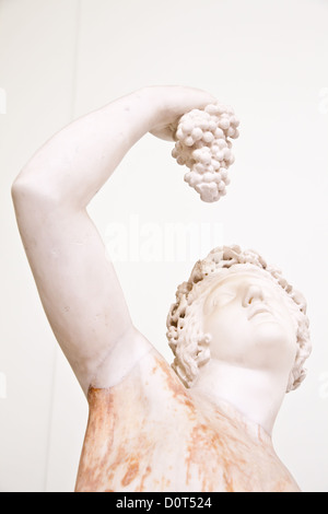 Statue of Dionysus or Bacchus with bunch of grapes isolated on white ...