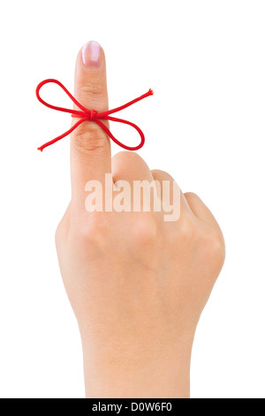 Woman with red bow on index finger against pink background. Reminder ...