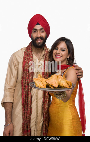 Hand holding samosa plate in hand isolated on white background Stock ...