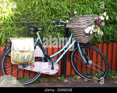 Bicycle with basket of flowers no people outdoors Stock Photo - Alamy
