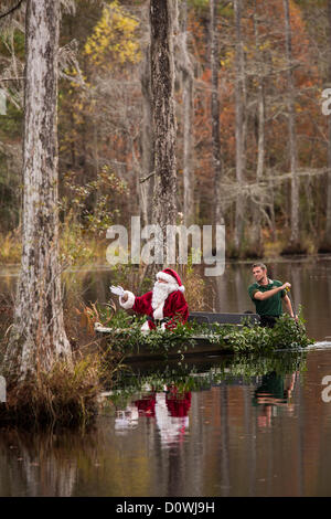 Charleston, USA. 1st December 2012. Santa Claus arrives by swamp boat ...