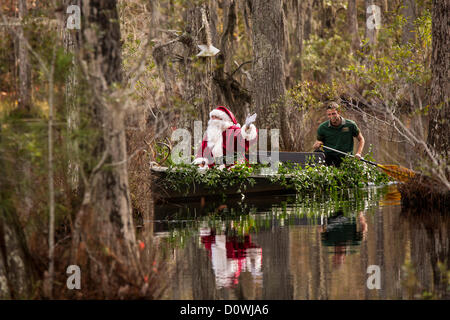 Charleston, USA. 1st December 2012. Santa Claus arrives by swamp boat ...