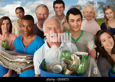 Group of people with recycling in bins Stock Photo - Alamy