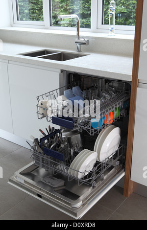 Open full dishwasher Stock Photo - Alamy