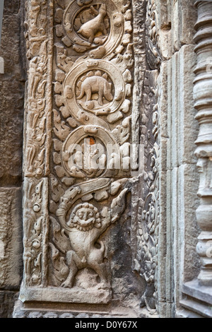 Stegosaurus dinosaur carving on the wall in Ta Prohm temple, Siem Reap ...