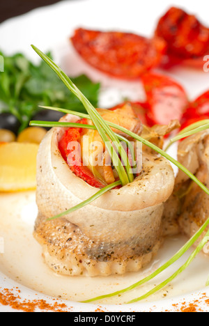 fillet of pikeperch stuffed with trout fish with baked pepper, tomato ...