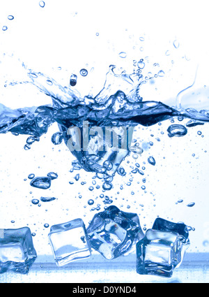 ice cube dropped into water with splash isolated on white Stock Photo - Alamy