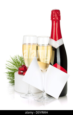Christmas greeting card with champagne bottle over red background. Top ...