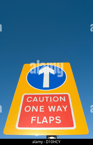 british road sign stating caution one way flaps Stock Photo - Alamy