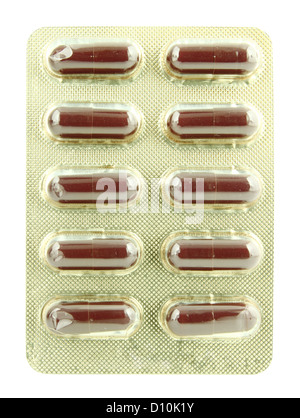 Red capsule pills and brown plastic drug bottle. Codeine and ...