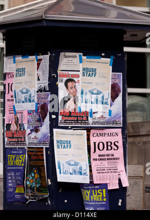 Flyers and ads on an outdoor bulletin board Stock Photo - Alamy