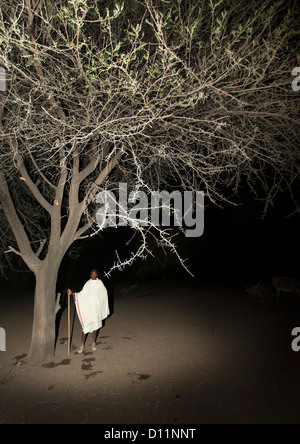 Night Shot Of A Karrayyu Tribe Man Bringing Food To Another Karrayyu ...