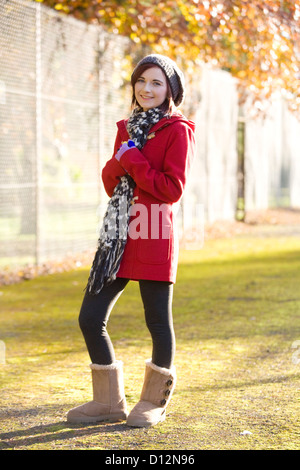 Young woman wearing casual red sweater over isolated background showing ...