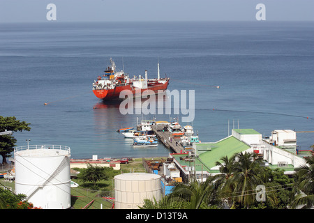 Industrial fuel storage tanks at marine terminal on coastline with ...