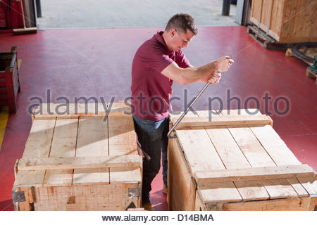 Two men in warehouse, one pointing with pen Stock Photo: 50014983 - Alamy