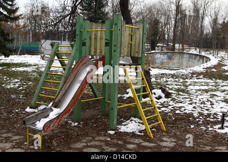 Old dilapidated playground for children Stock Photo - Alamy