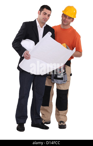 Tradesman and engineer working together Stock Photo - Alamy