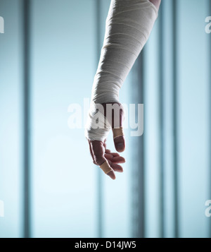 Hand wrapped in white bandage on a white background Stock Photo - Alamy
