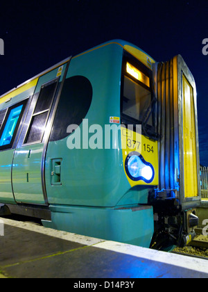 "Electrostar" under a starlit and moonlit night sky, an empty railway ...